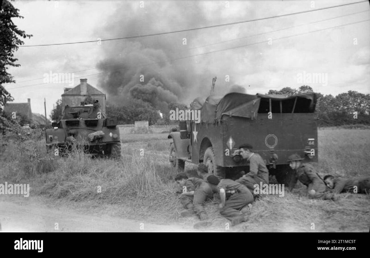 The British Army in the Normandy Campaign 1944 Troops shelter behind a ...