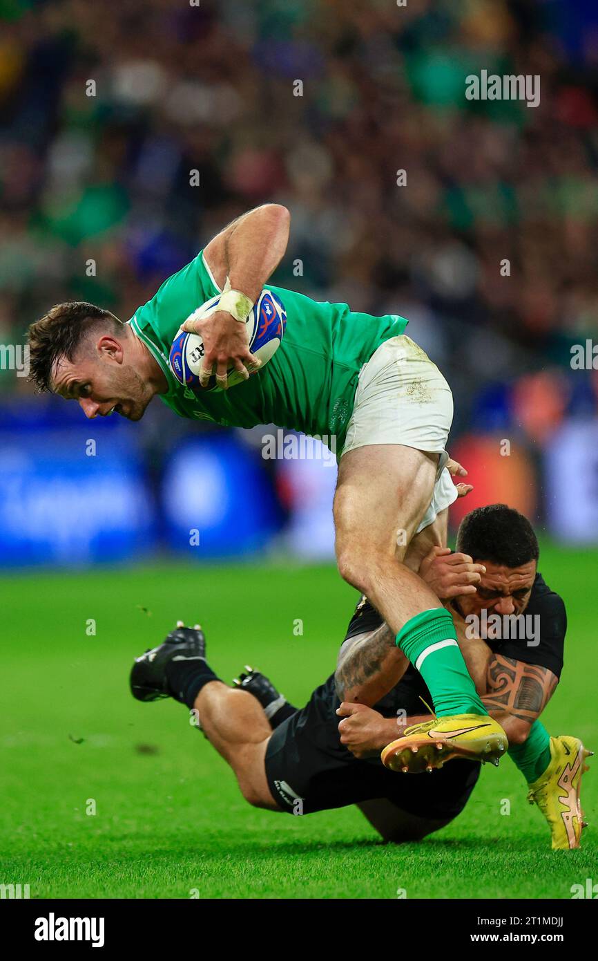 Ireland's Hugo Keenan, top, and New Zealand's Codie Taylor challenge ...