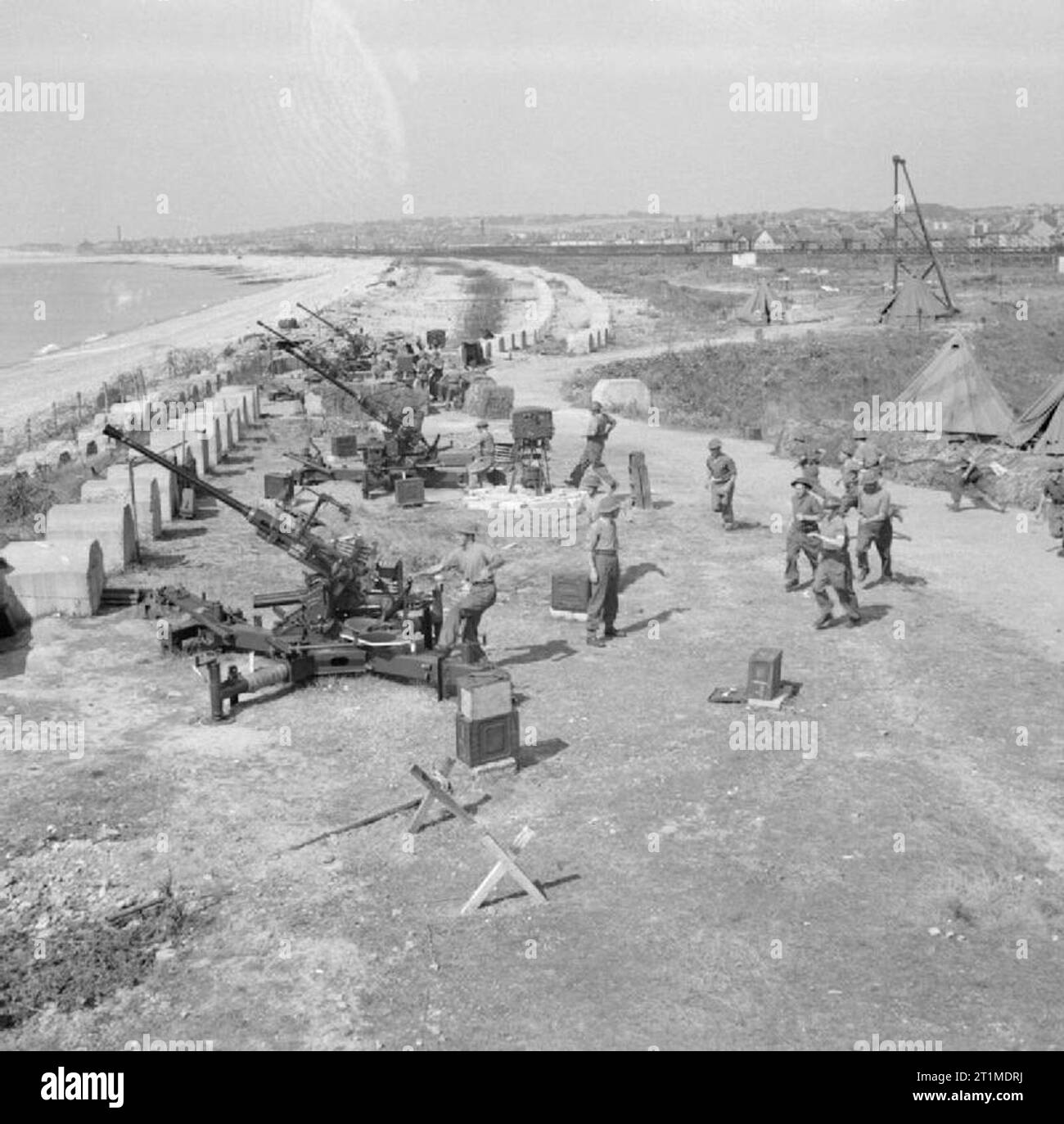The British Army in the United Kingdom 1939-45 Crews rush to their Bofors guns at a South Coast ...