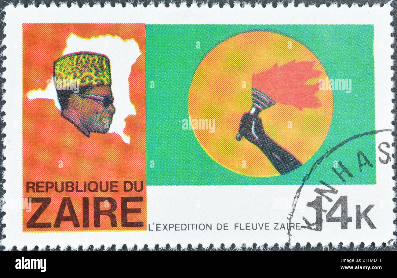 Cancelled postage stamp printed by Zaire, that shows Hand with torch ...