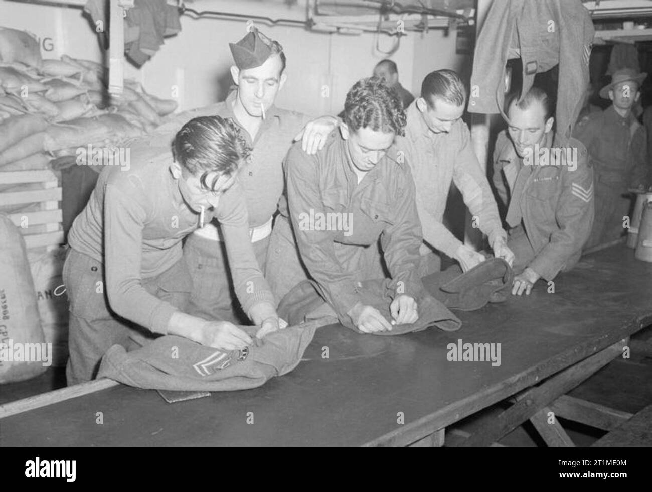 British Soldiers and Civilians From the Far East Soldiers sew medal ...