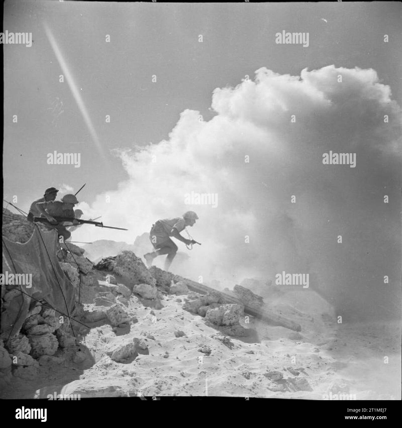 The Campaign in North Africa 1940 - 1943 Australian infantry storm a strongpoint through a dense ...