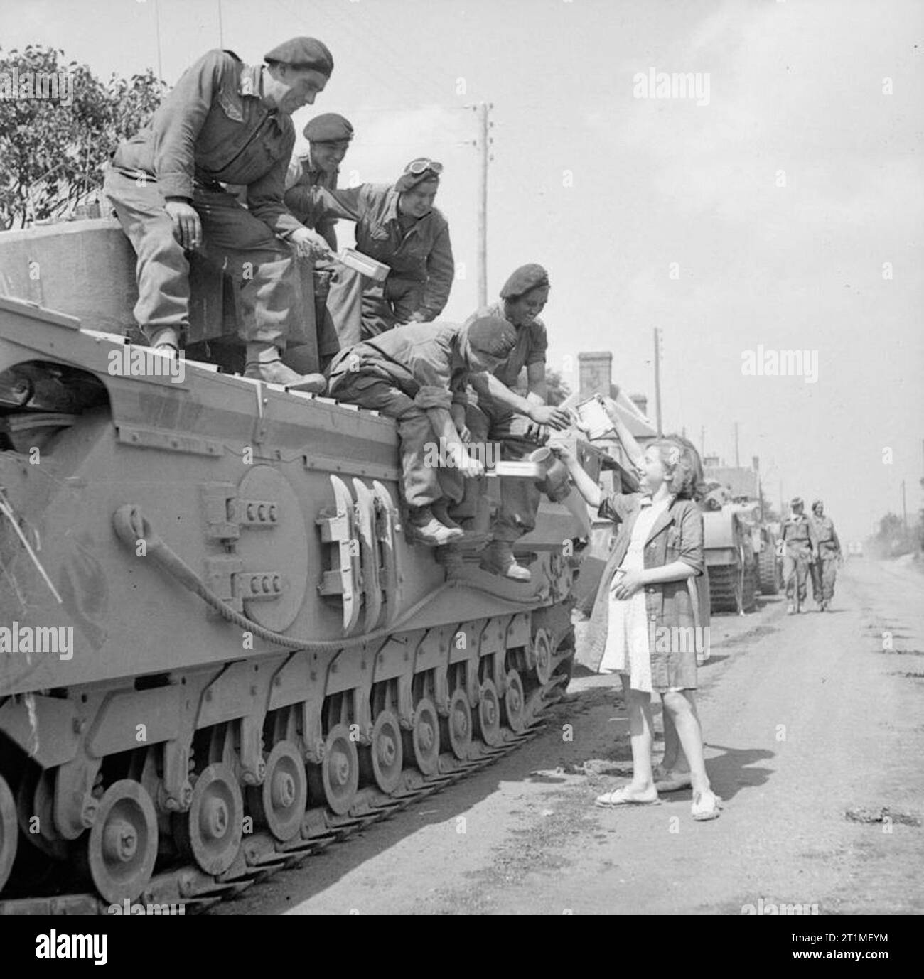 British Tanks in Nw Europe 1944-45 French children bring out milk and ...