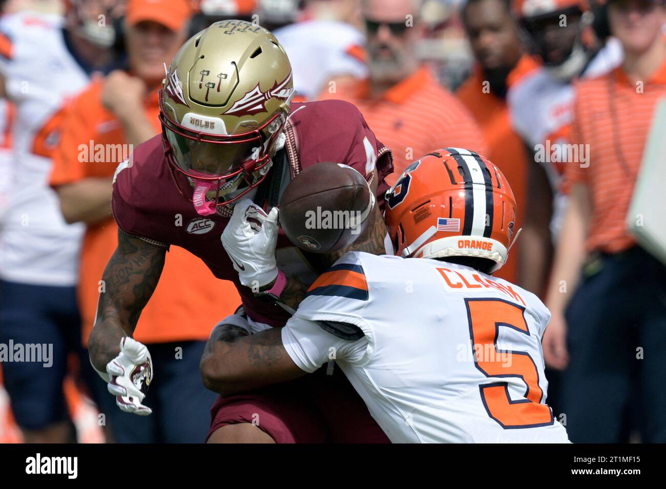 Florida State wide receiver Keon Coleman (4) fumbles after getting hit ...