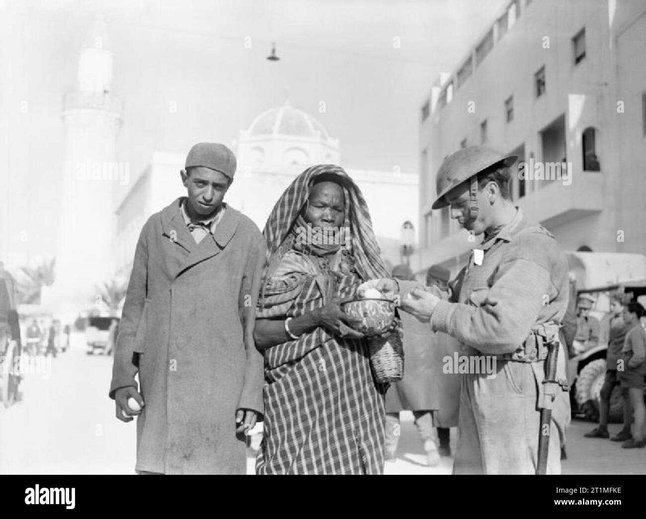 The Libyan Campaign A British soldier buying eggs from a native woman ...