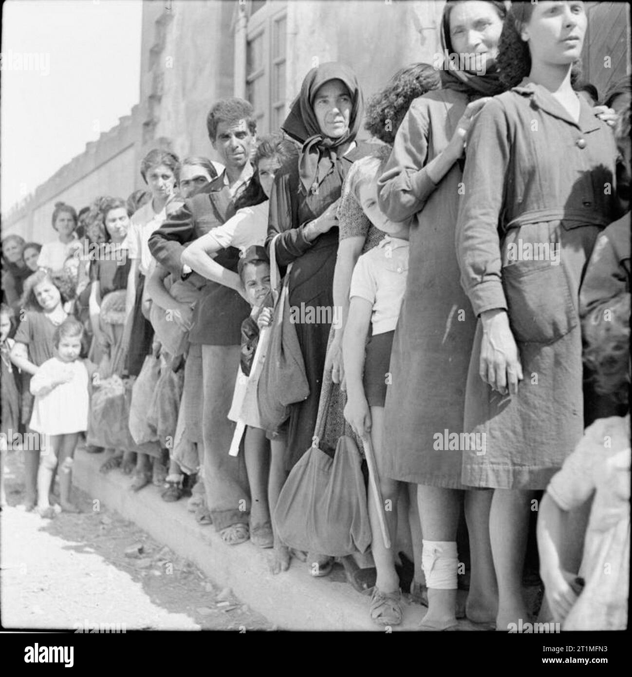 Queue ration Black and White Stock Photos & Images - Alamy