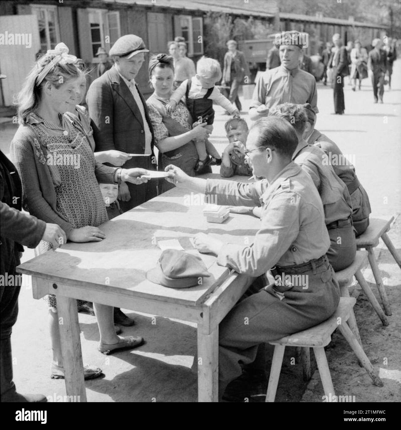 A Polish family registering at No.17 Displaced Persons Assembly Centre ...