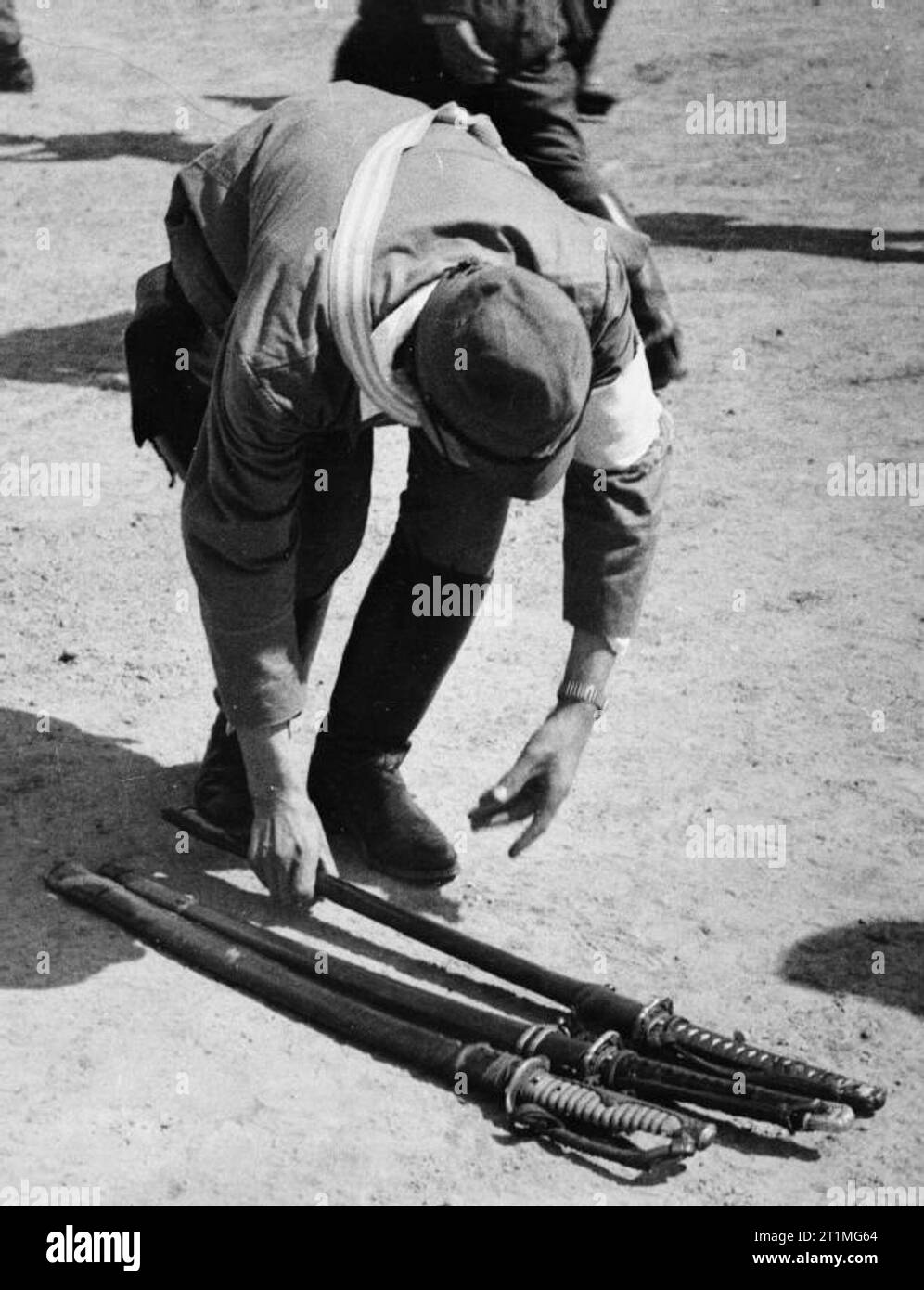 Japanese Surrender in Malaya, 1945 A Japanese officer surrenders his ...