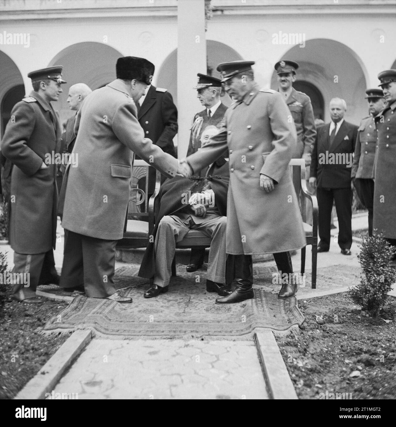 Winston Churchill greets Joseph Stalin with President Roosevelt outside ...