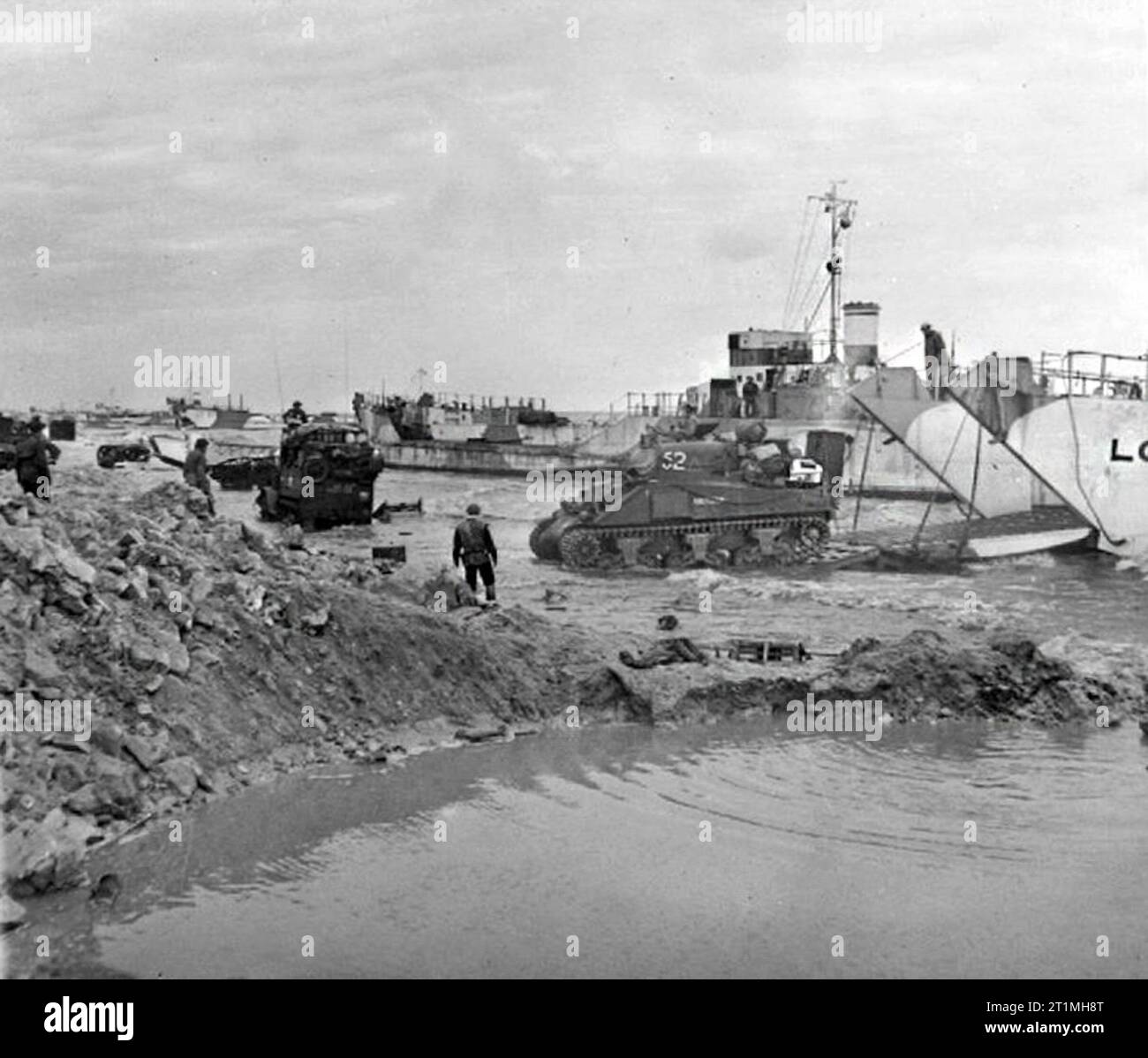 The Invasion of Normandy 1944 A Sherman tank comes ashore from a ...