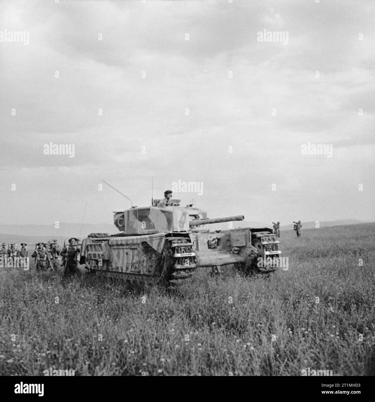 A Churchill tank and infantry advancing near Medjez-el-Bab, Tunisia, 8 ...