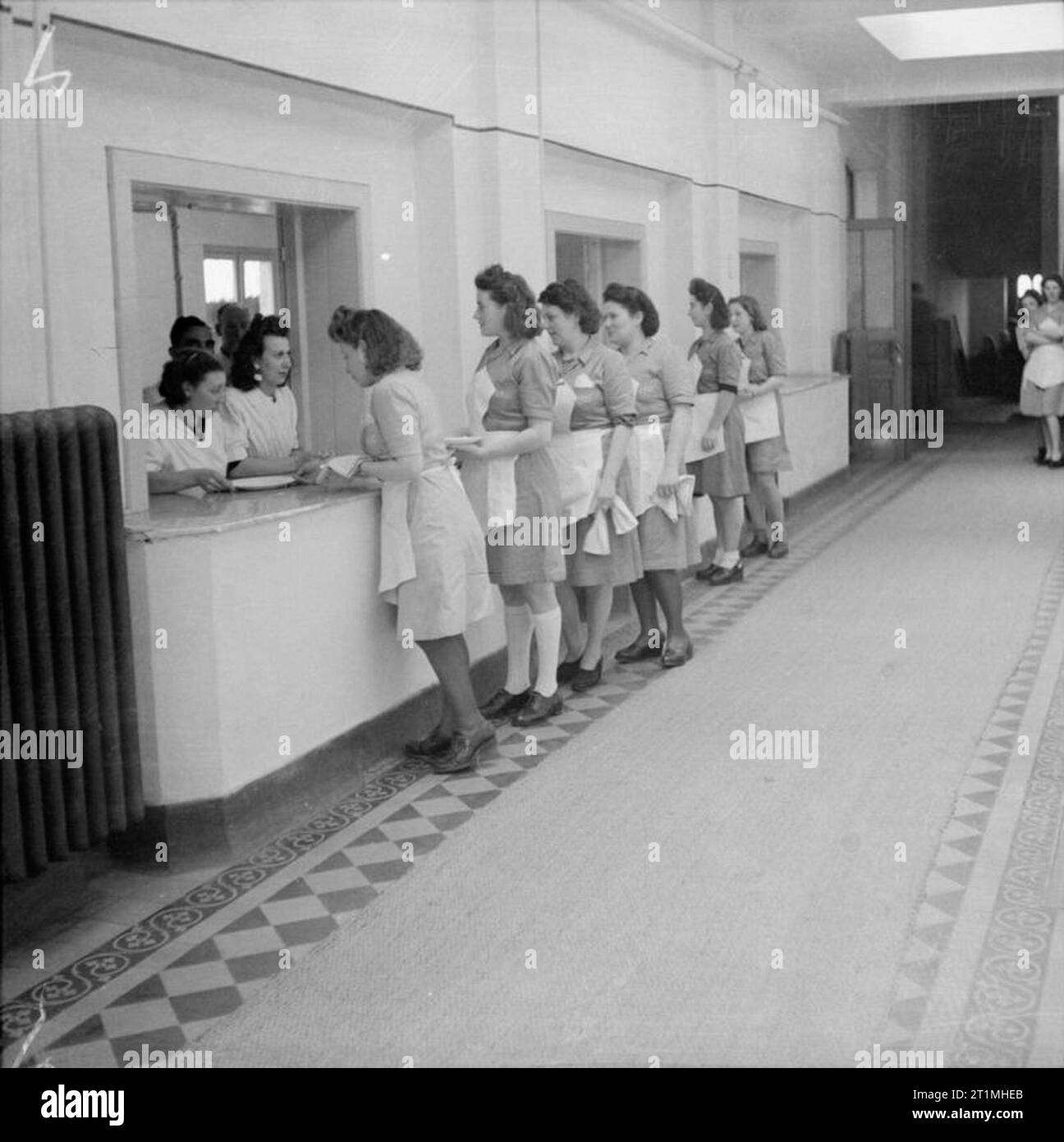 Demobilisation of the British Army Belgian waitresses prepare to serve ...