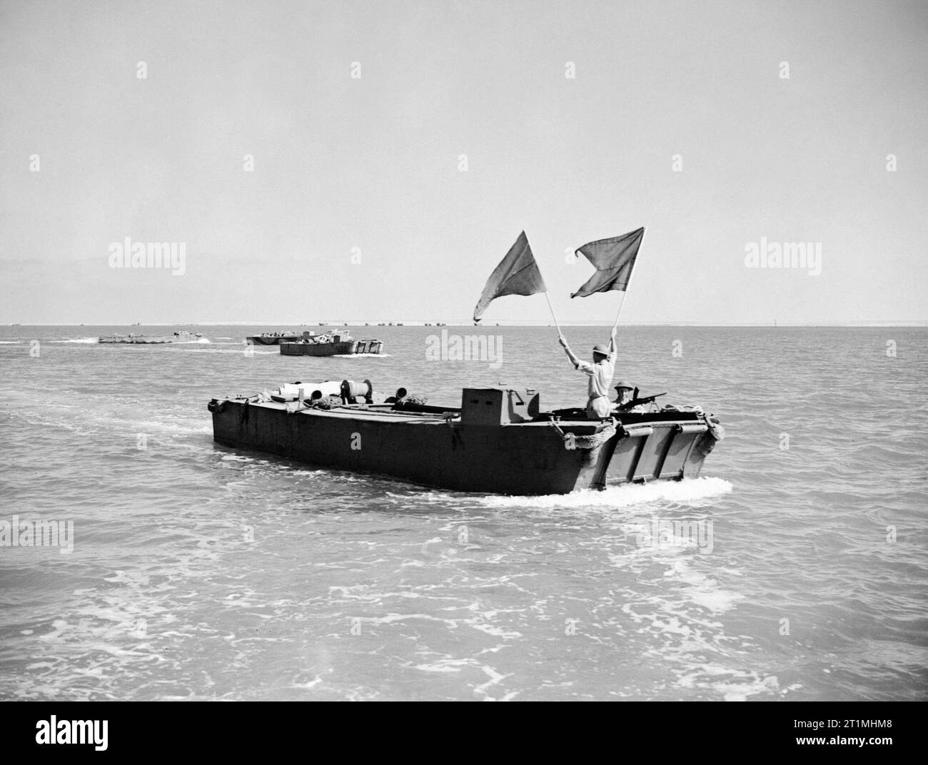 Royal Navy beach parties and commandos training with landing craft at ...