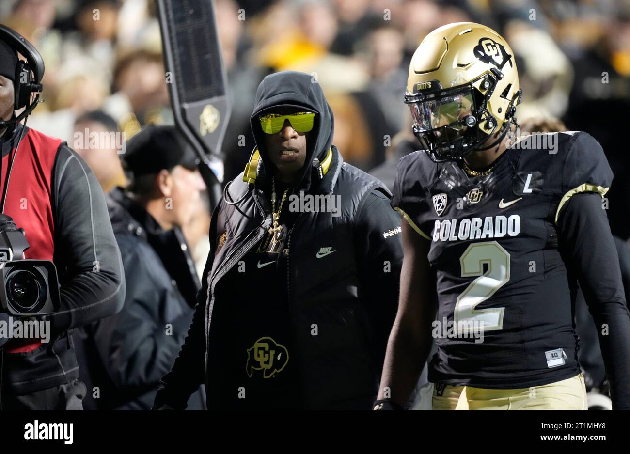 Colorado head coach Deion Sanders talks with his son, quarterback ...
