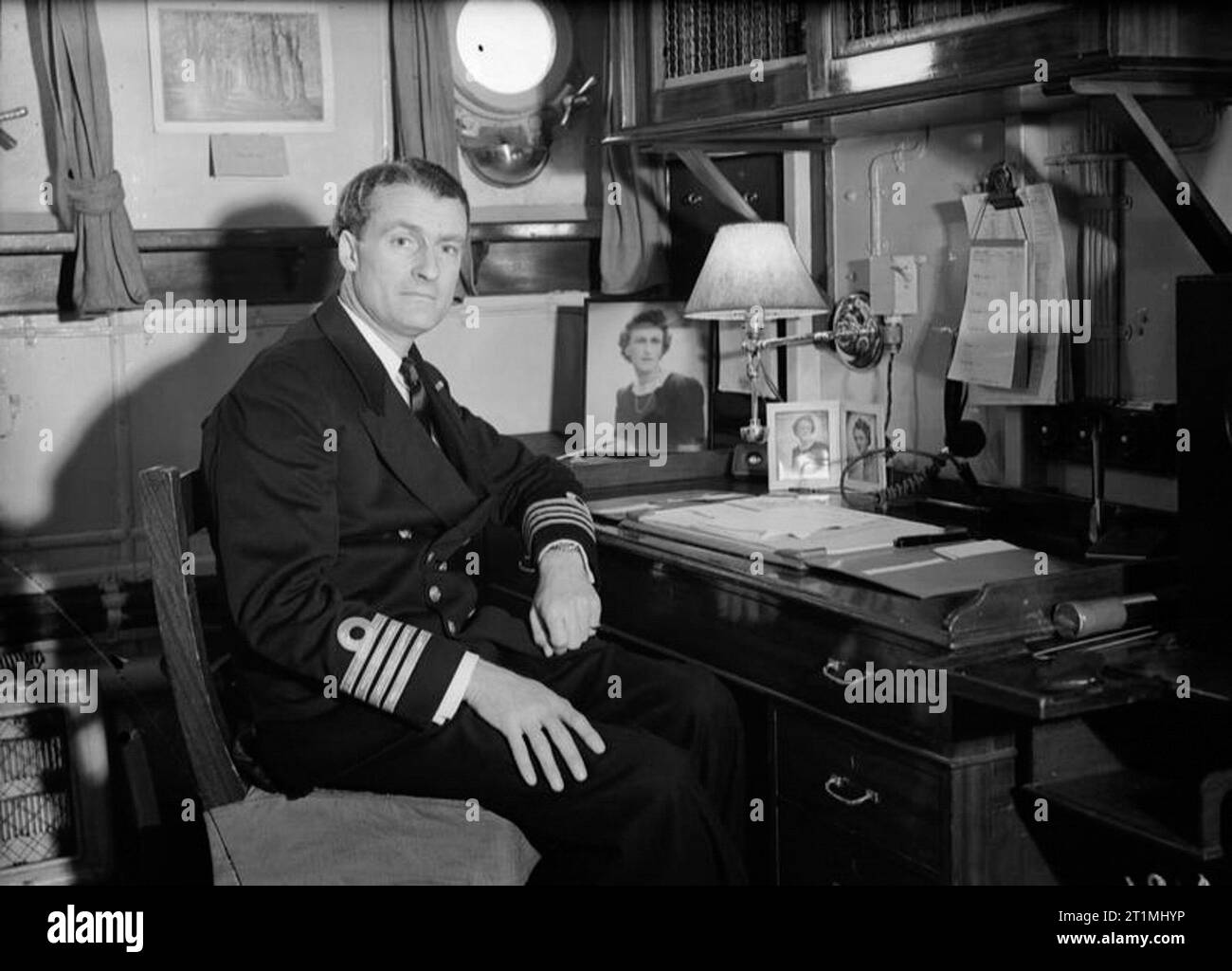 Captain (d) a K Scott-moncrief, Rn, at His Desk in His Cabin Aboard HMS ...