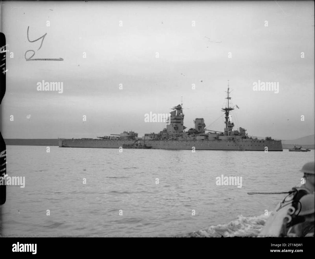 The Royal Navy during the Second World War HMS RODNEY moored with a ...