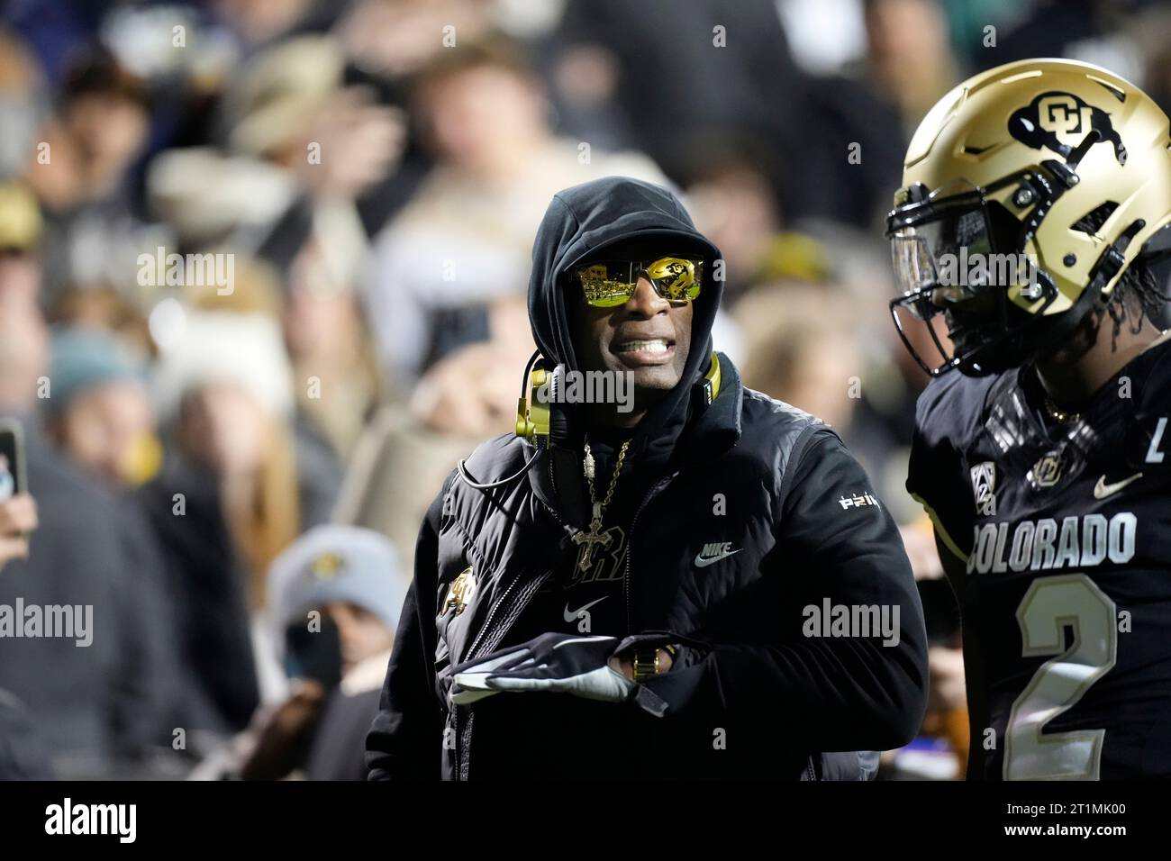 Colorado head coach Deion Sanders chats with his son, quarterback ...
