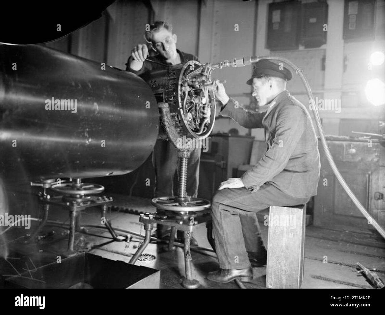 The Royal Navy during the Second World War Two men are working in the ...