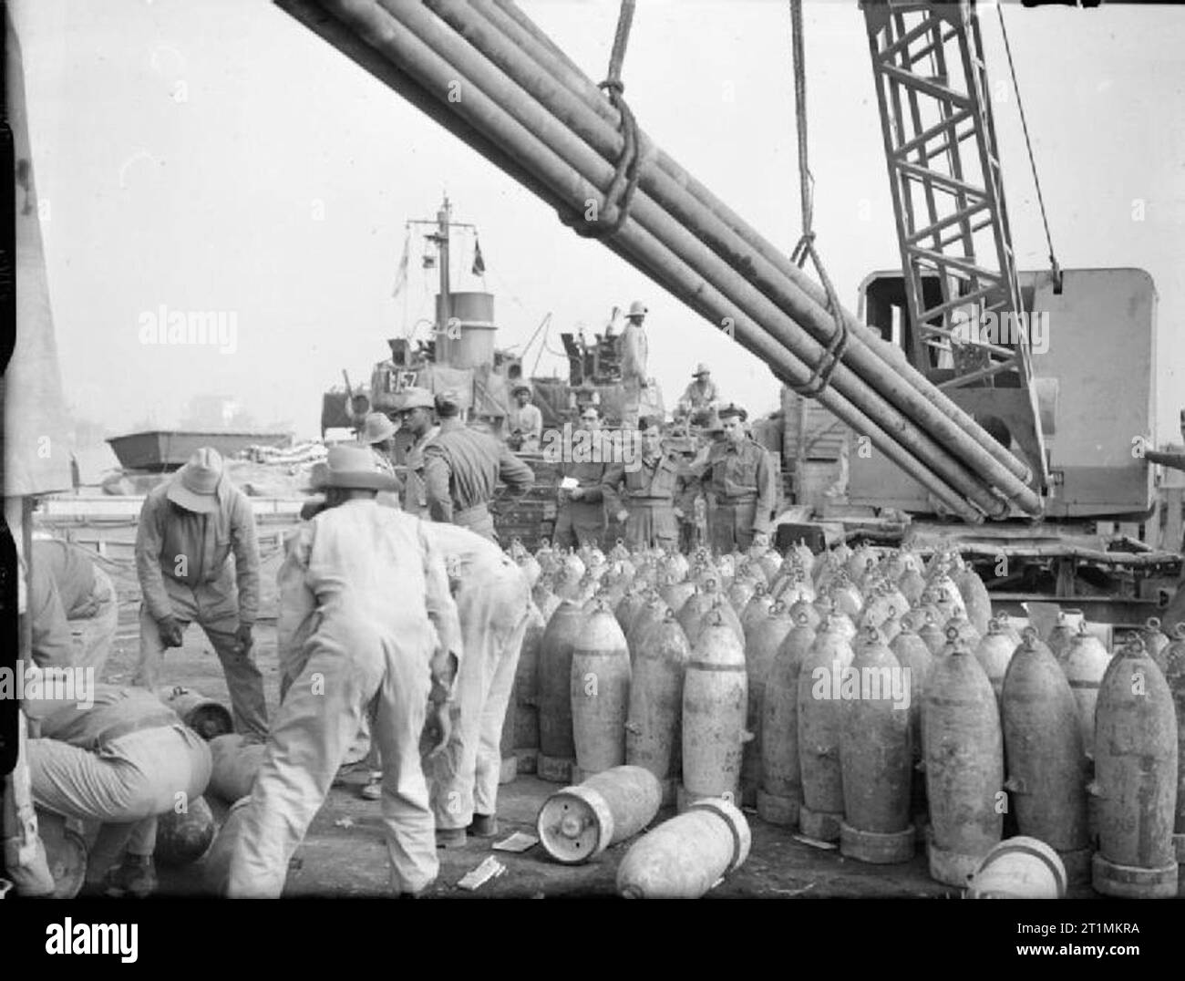 The Royal Navy during the Second World War Unloading bombs and pipes ...