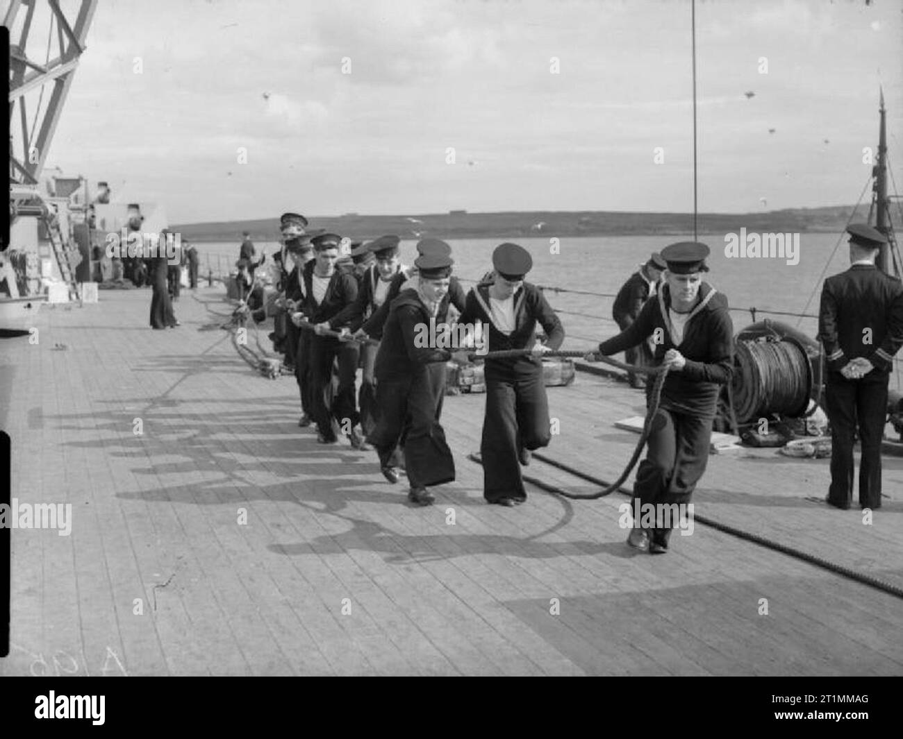 The Royal Navy during the Second World War Sailors drag a rope attached ...