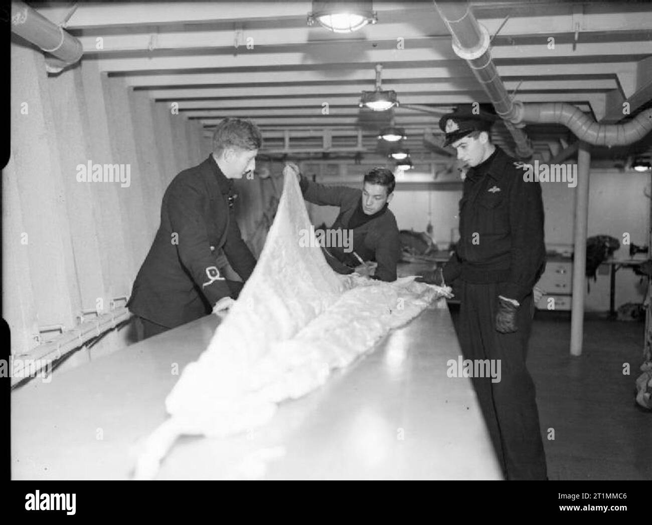 The Royal Navy during the Second World War Three men working on a ...