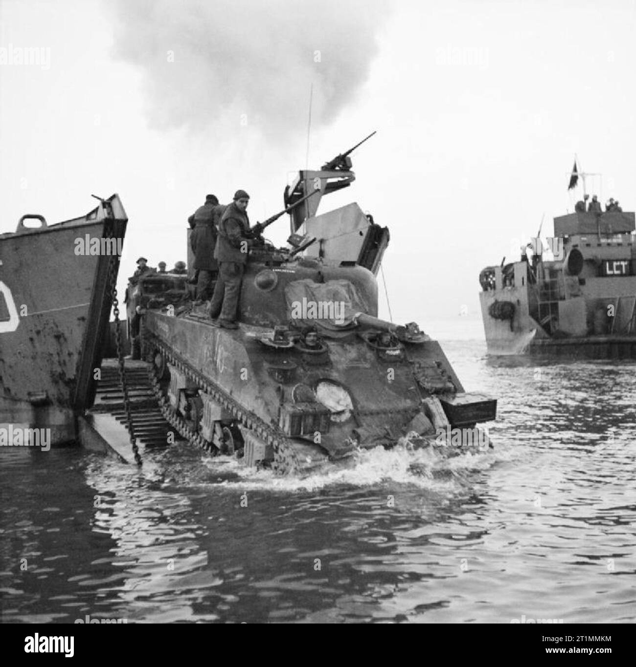 A Sherman tank of 23rd Armoured Brigade coming ashore from a landing ...