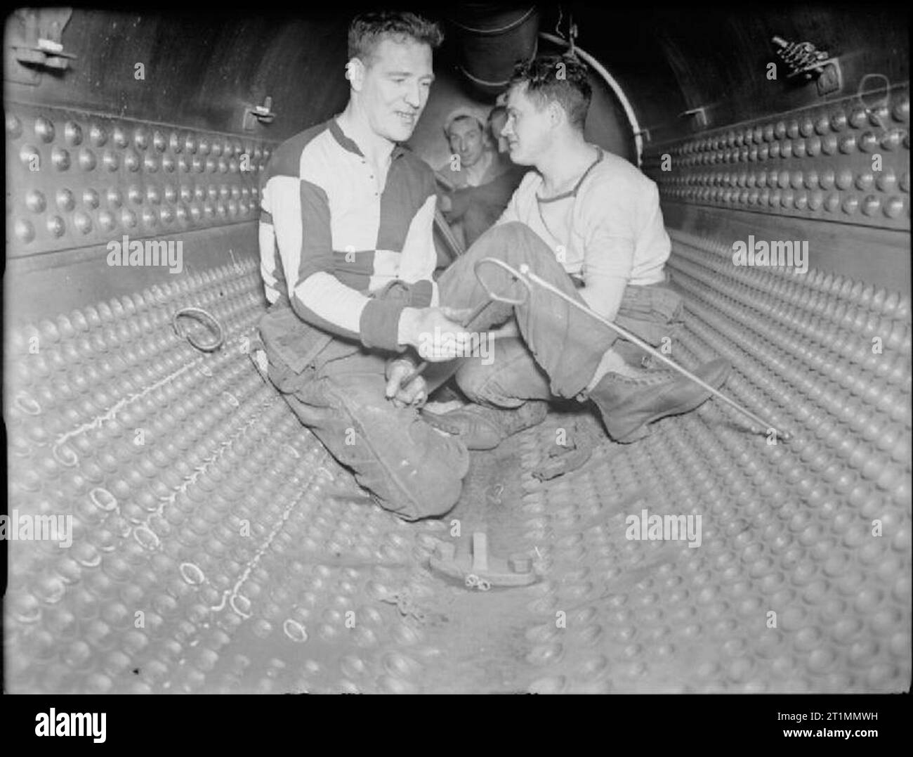The Royal Navy during the Second World War Boiler cleaners at work in ...