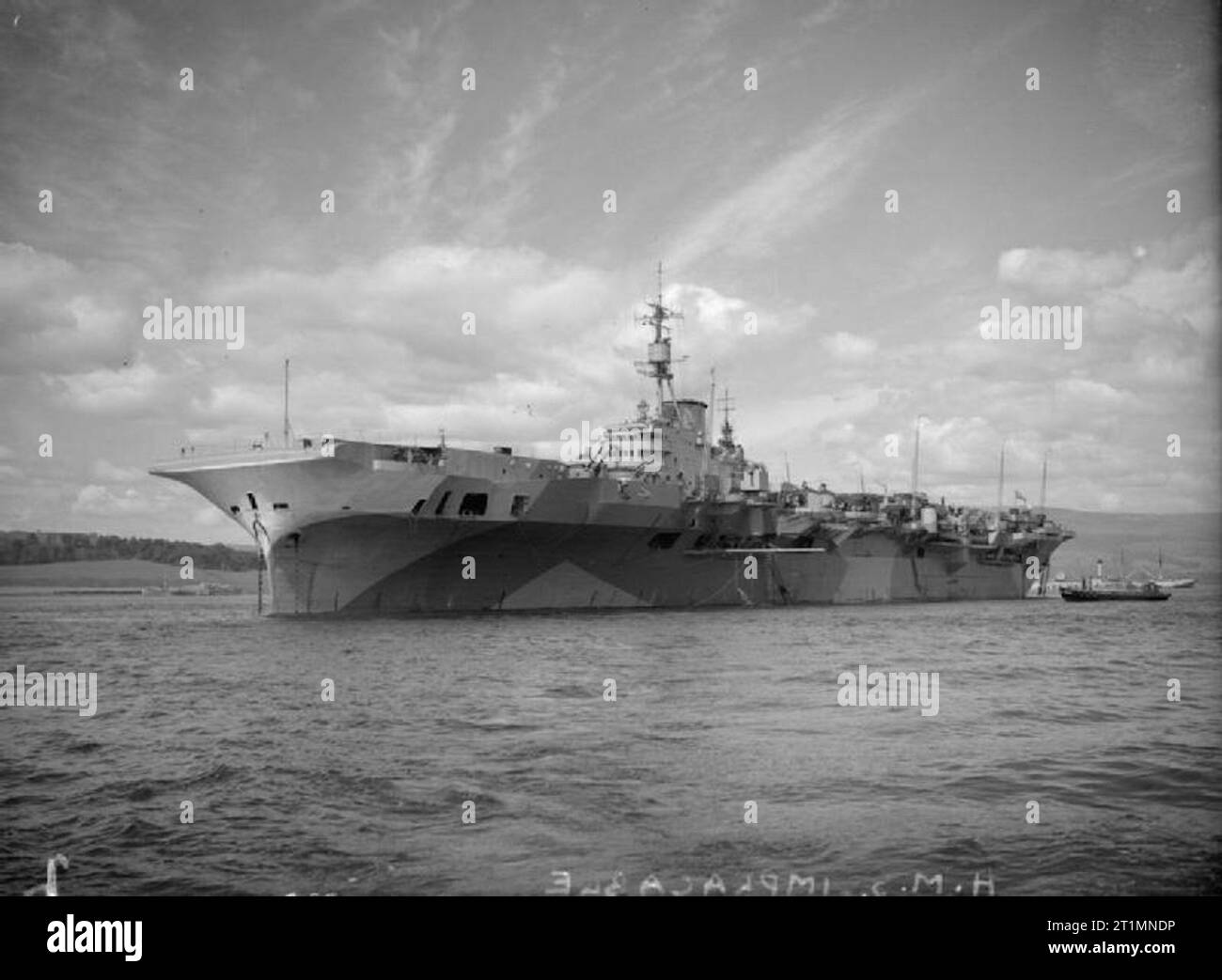 The Royal Navy during the Second World War HMS IMPLACABLE at anchor at ...
