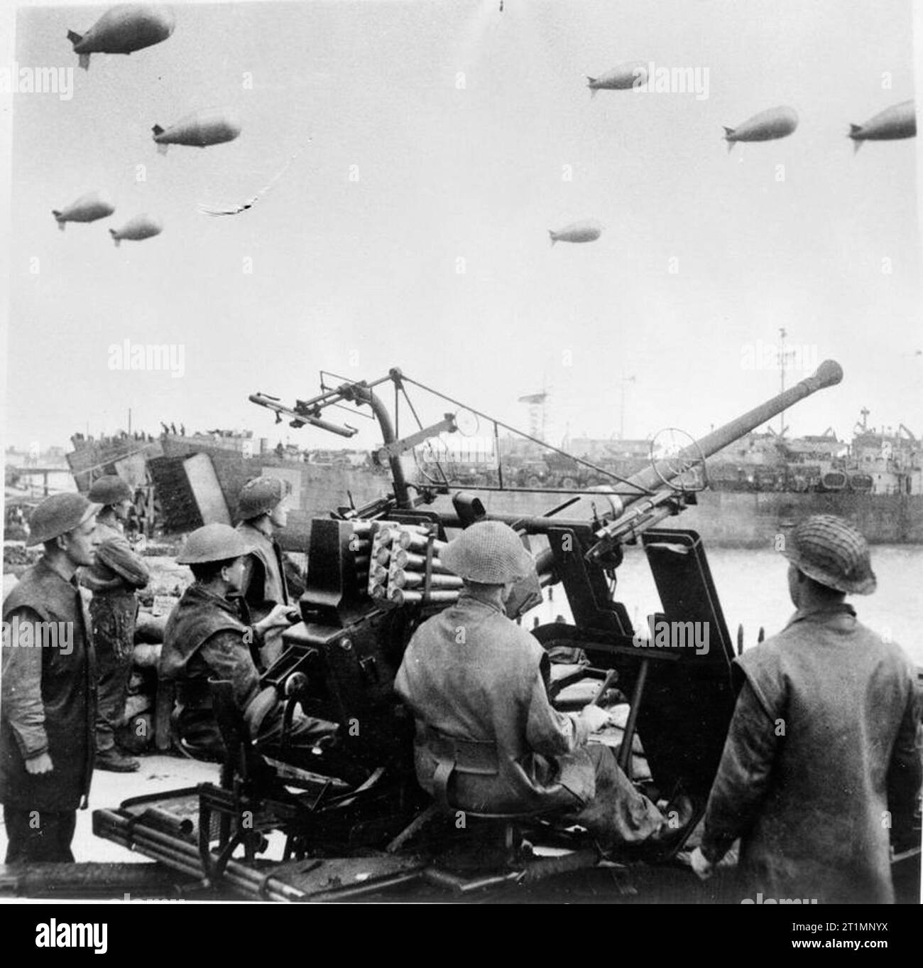 Preparations For the Invasion of Normandy 1944 A Bofors gun crew stand ...
