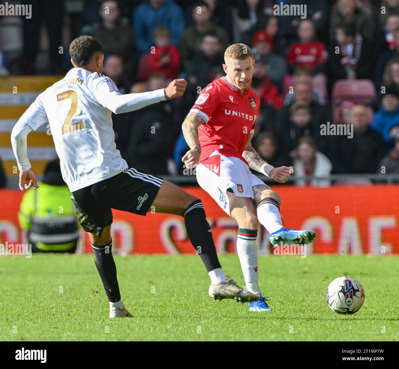 James McClean 23# of Wrexham Association Football Club passes the ball ...