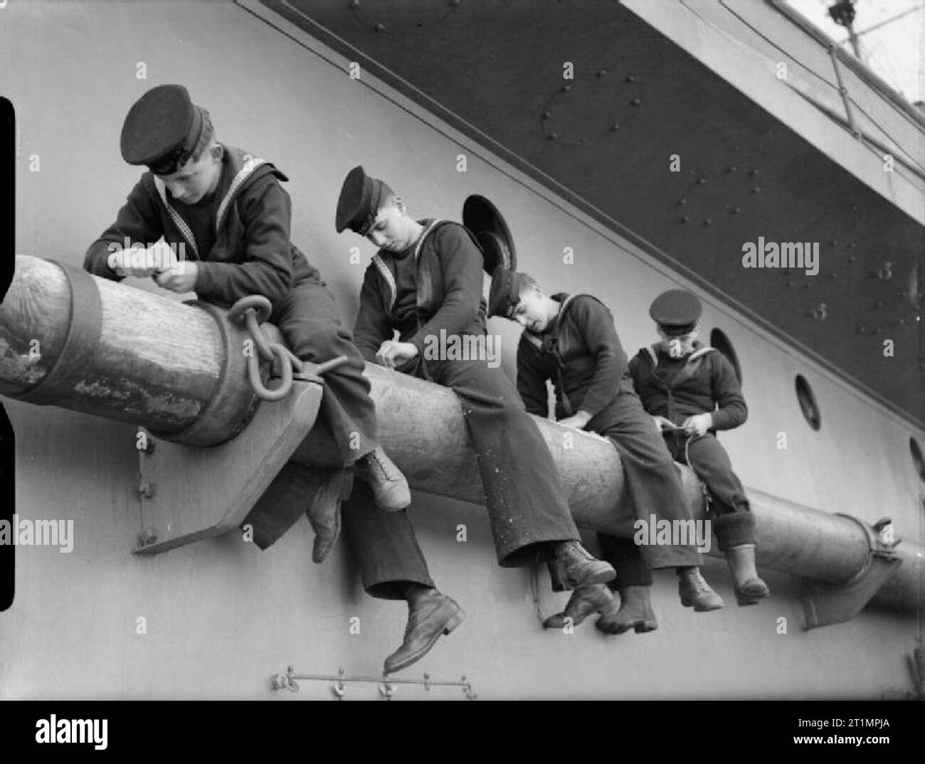 The Royal Navy during the Second World War Four sailors sit astride one ...