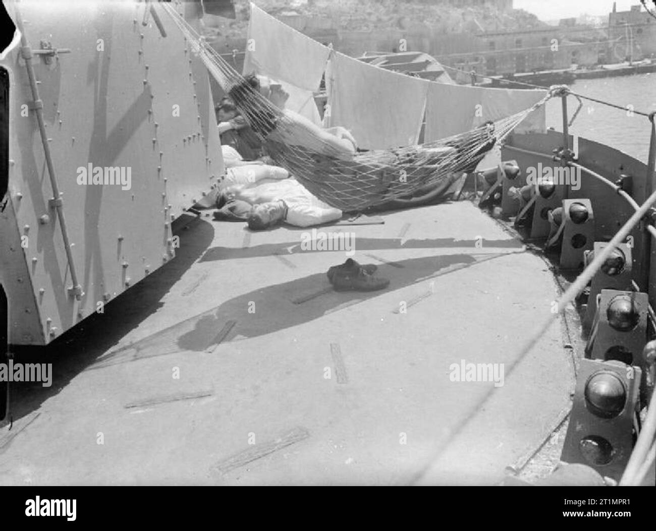 The Royal Navy during the Second World War Crewmen resting on the deck ...