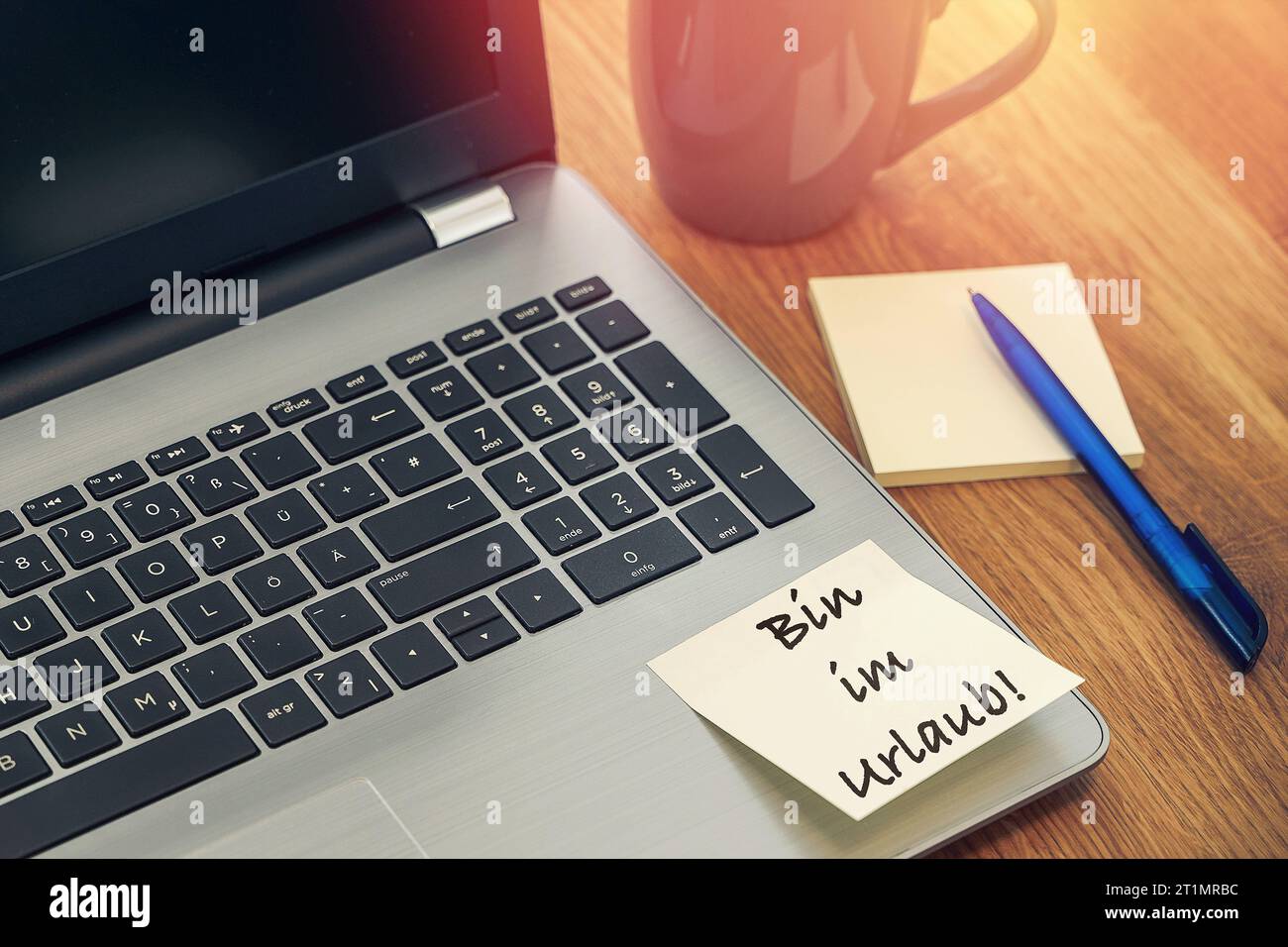 14 October 2023: Desk with cup and laptop computer with note: Am on ...