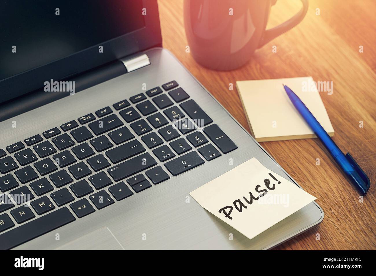 14 October 2023: Desk with cup and laptop computer with note: break ...