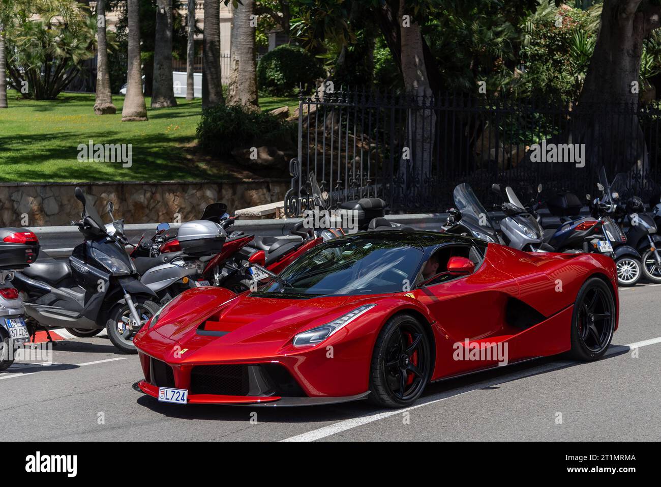 Rosso Fuoco Ferrari LaFerrari driving on the road Stock Photo - Alamy