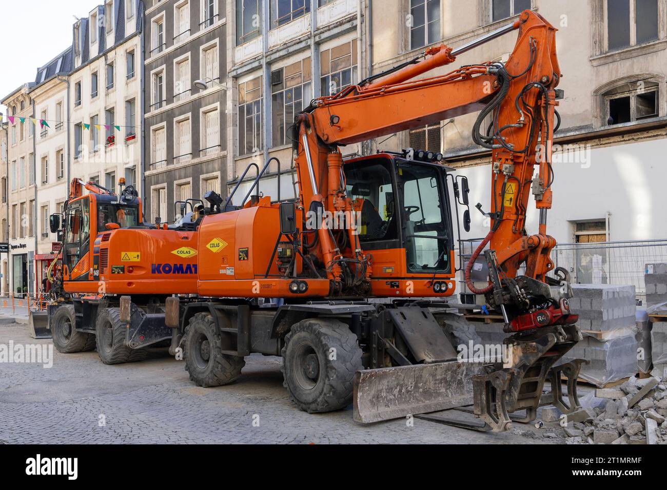 Orange wheeled excavators Komatsu PW148-10 on construction site Stock ...