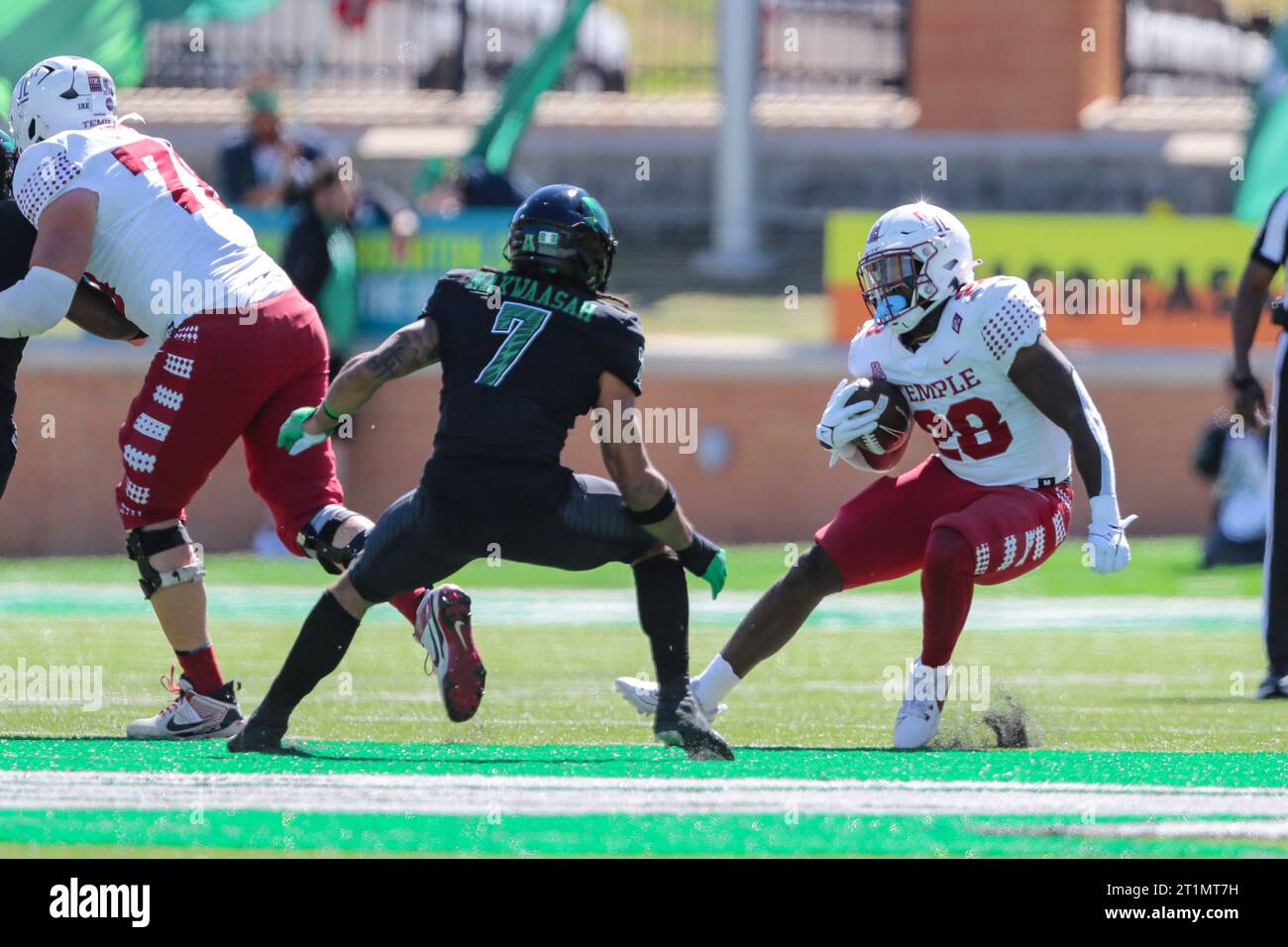 October 14, 2023:.Temple Owls running back Darvon Hubbard (28) avoids a ...