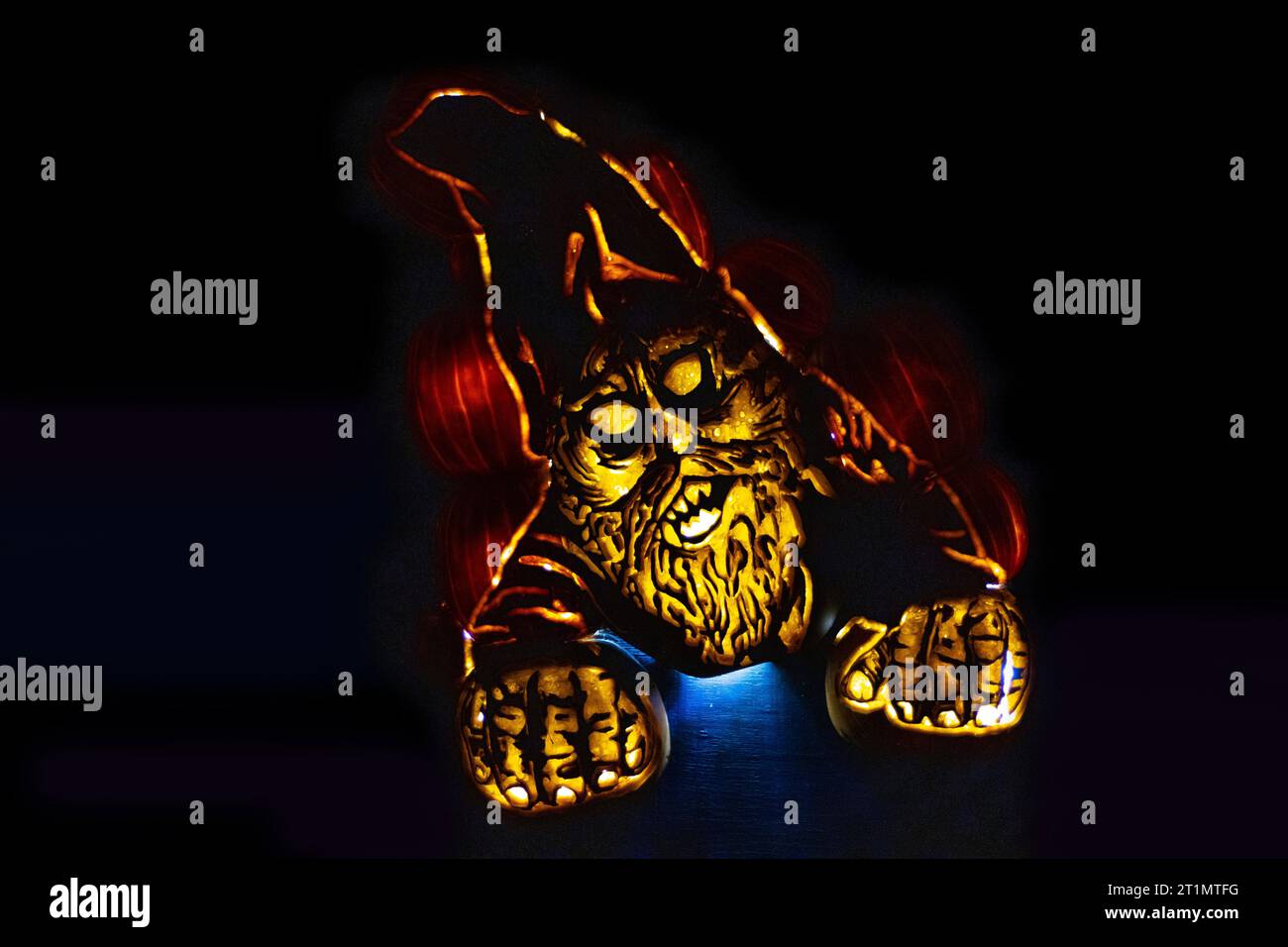 scary gnome crawling towards us illuminated on black background Stock ...
