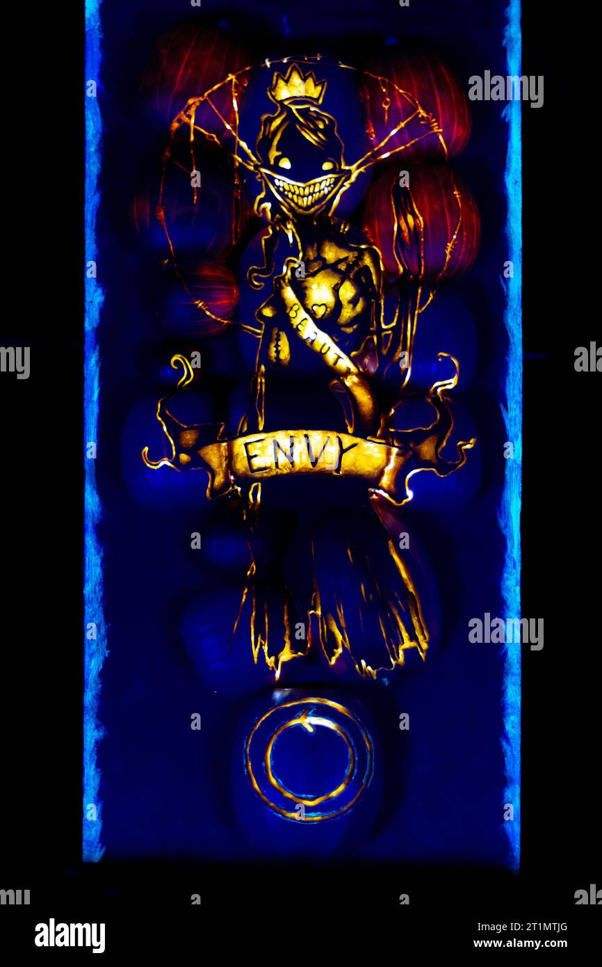 envy illuminated with black background Stock Photo - Alamy