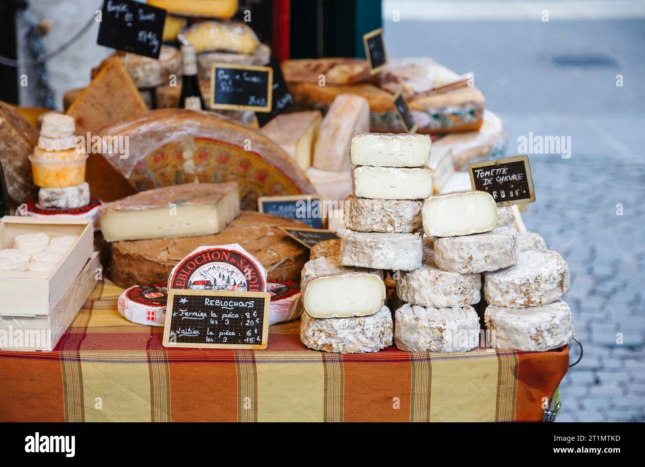 Cheese stall and display of local artisanal cheeses in an outside ...
