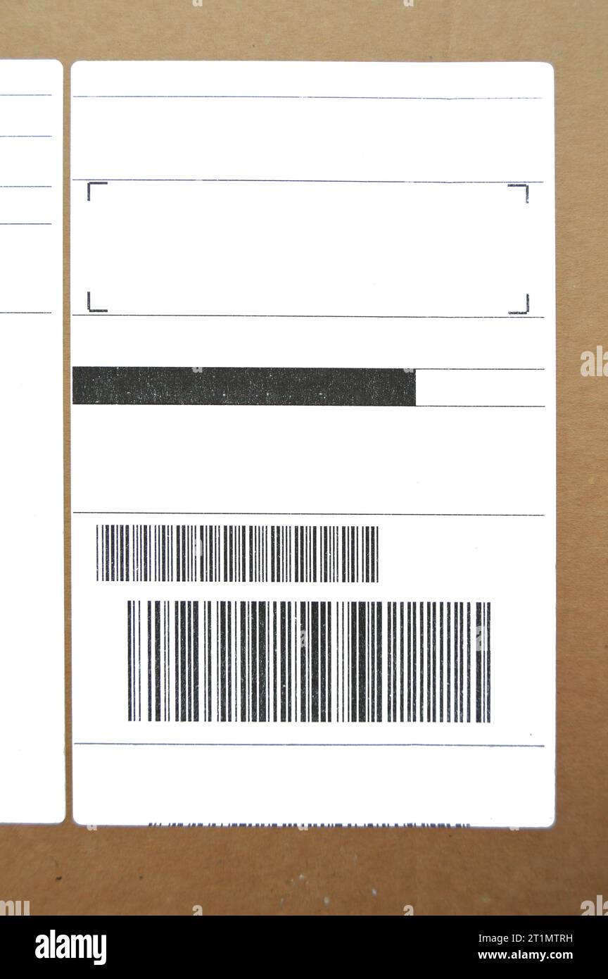 Brown and beige cardboard paper mail envelope on sticky barcodes. Can ...