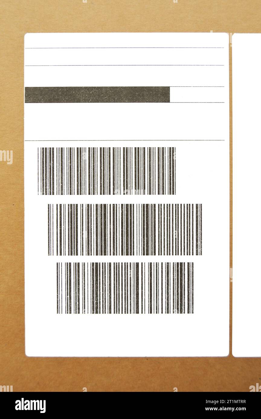 Brown and beige cardboard paper mail envelope on sticky barcodes. Can ...