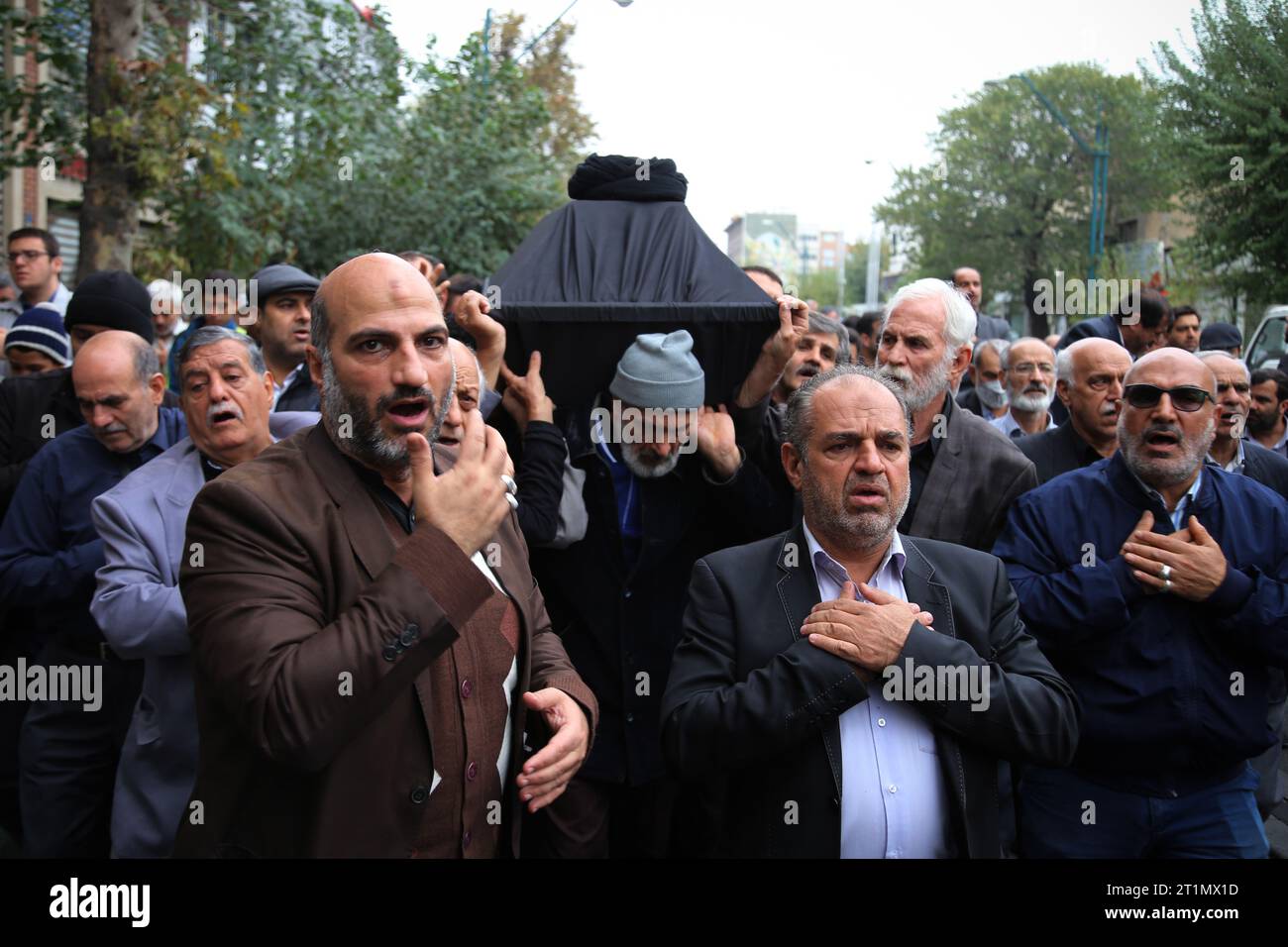 Tehran, Iran. 13th Oct, 2023. Iranian mourners attend a funeral ...