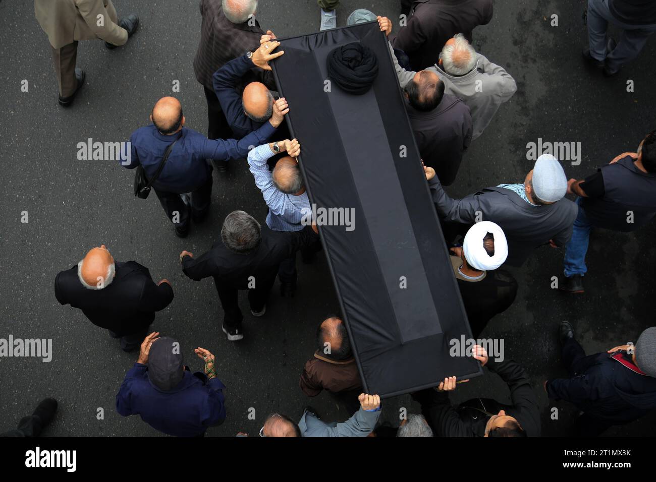 Tehran, Iran. 13th Oct, 2023. Iranian mourners attend a funeral ...