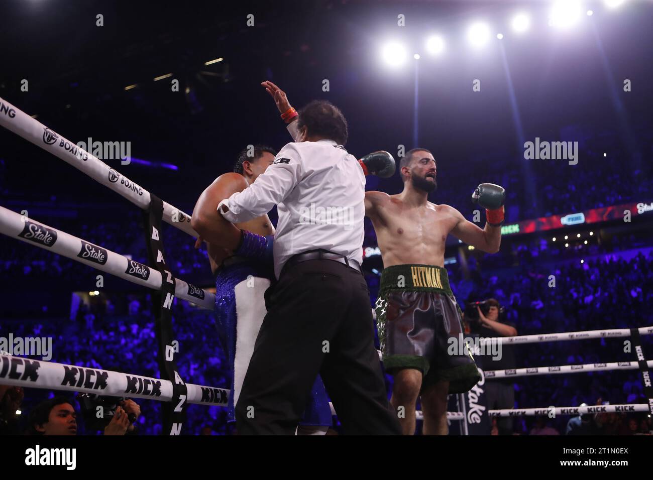 Slim (right) celebrates beating Salt Papi during their middleweight ...