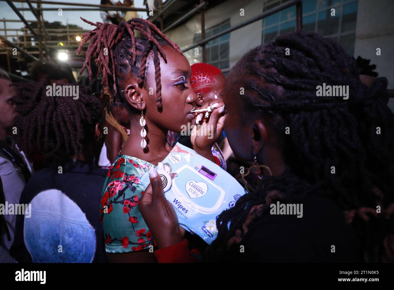 Nairobi, Kenya. 14th Oct, 2023. A model gets ready in backstage before ...