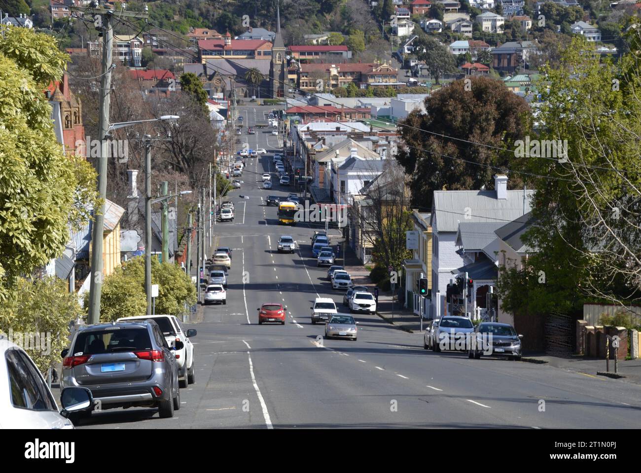 Steep city street in the city of Launceston in Tasmania has cars ...