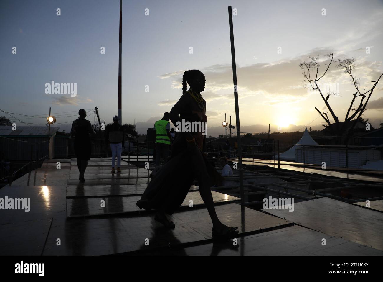 Nairobi, Kenya. 14th Oct, 2023. A model in silhouette hits the runway ...