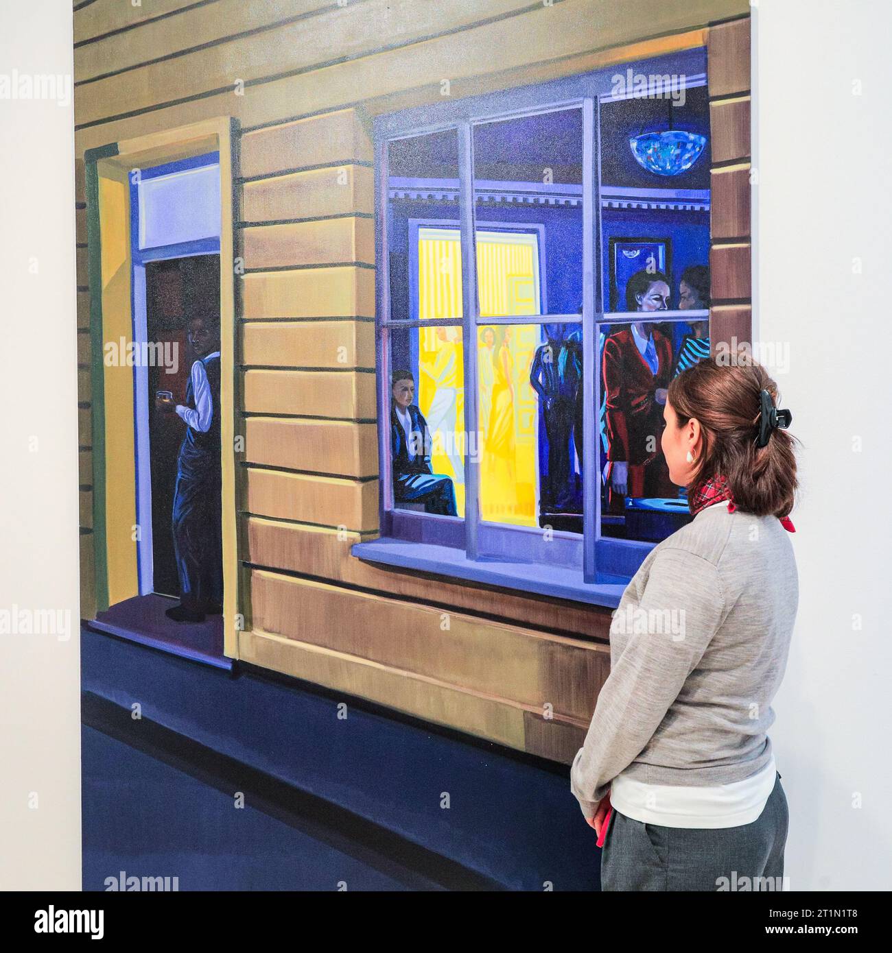 London, UK. 14th Oct, 2023. A gallery representative with Cece Philips ...
