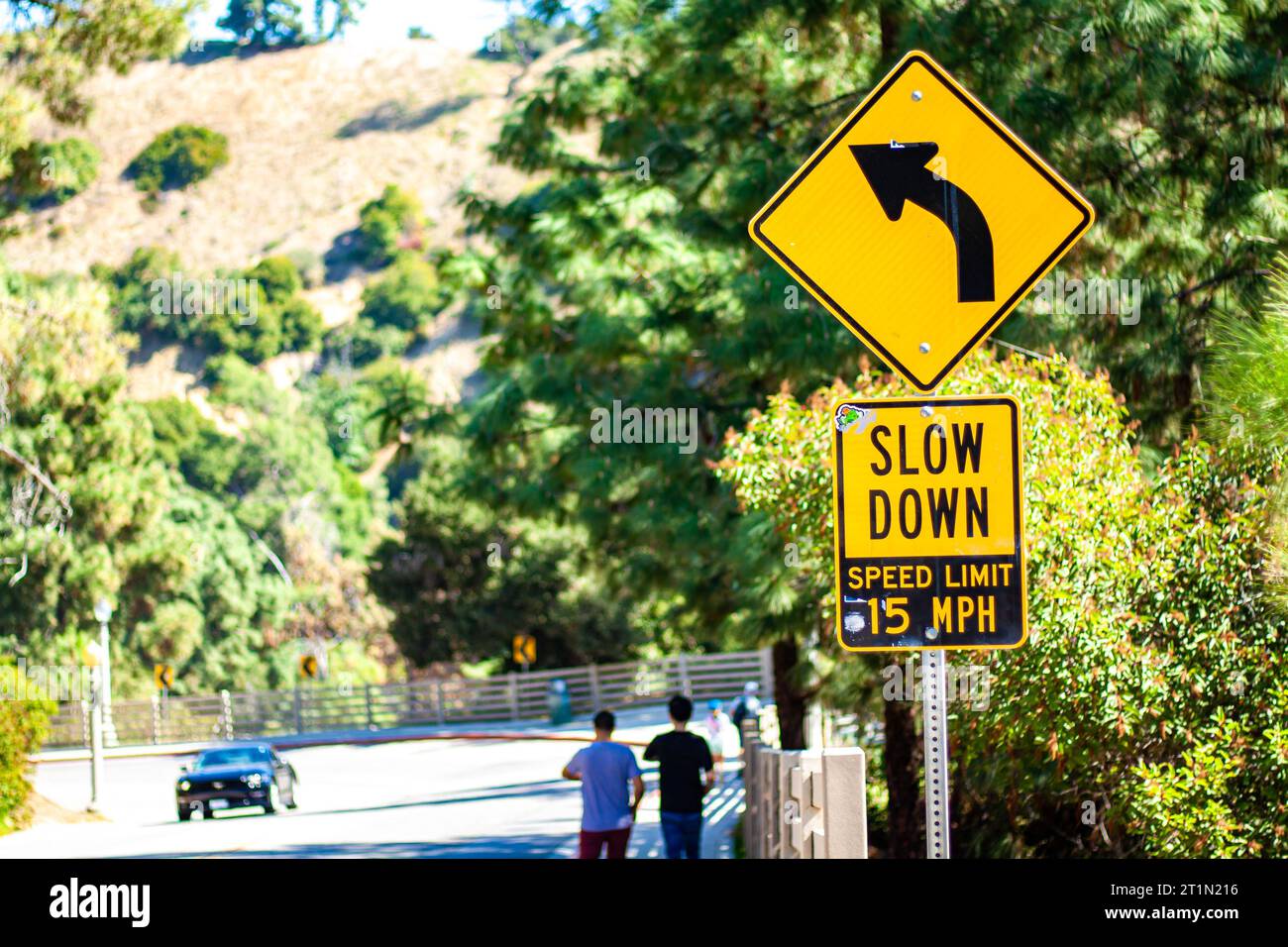 Slow Down street sign in California Stock Photo - Alamy